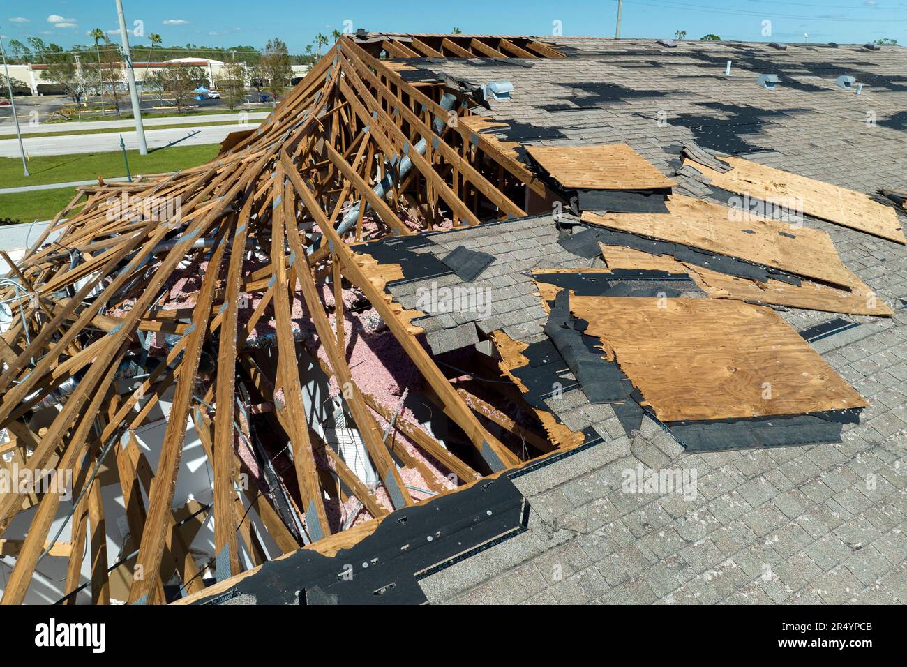 Consequences of natural disaster. Damaged house roof with missing ...
