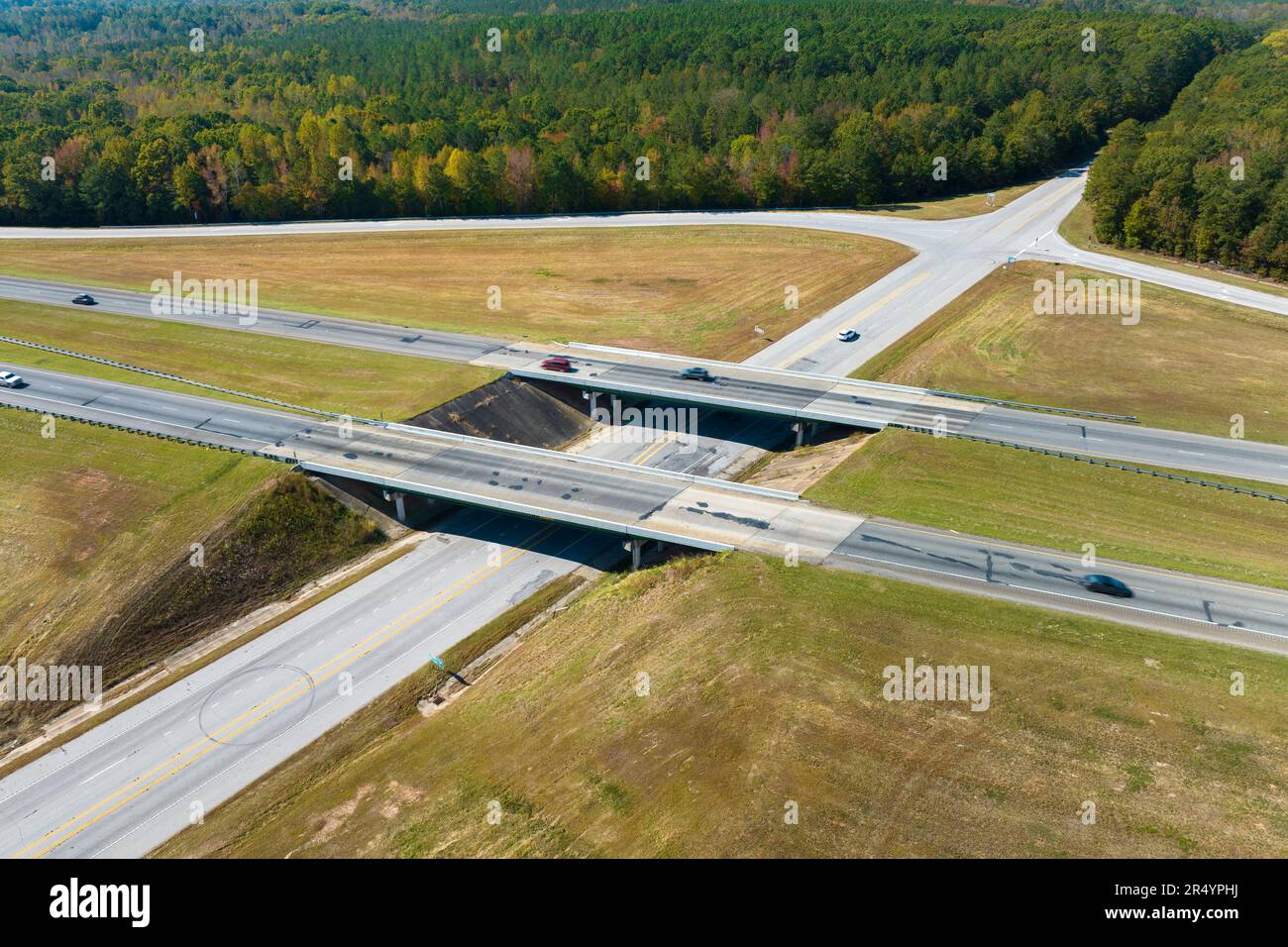 Aerial flyover over forest road hi-res stock photography and images - Alamy