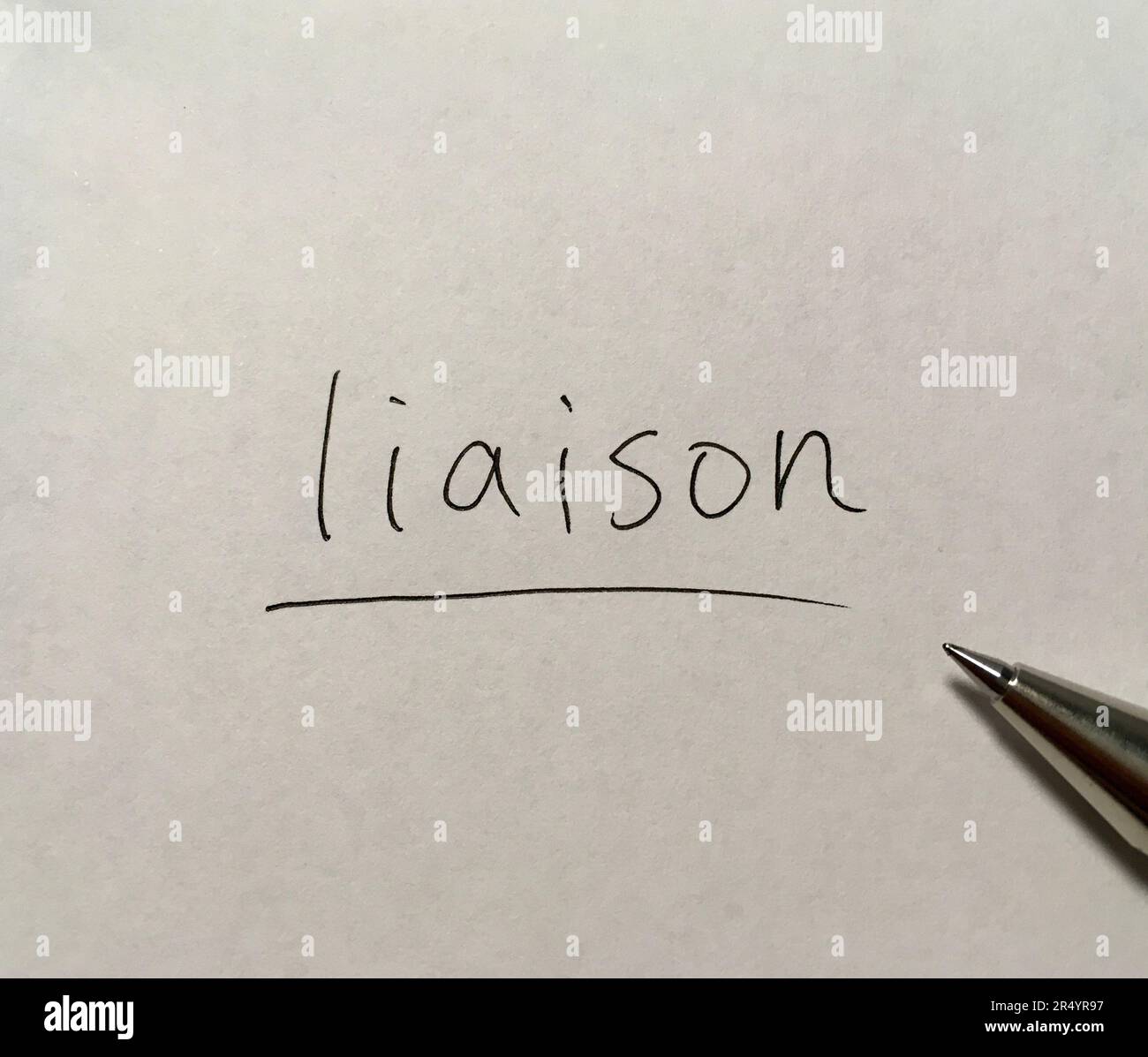 Liaison concept word on paper background Stock Photo - Alamy