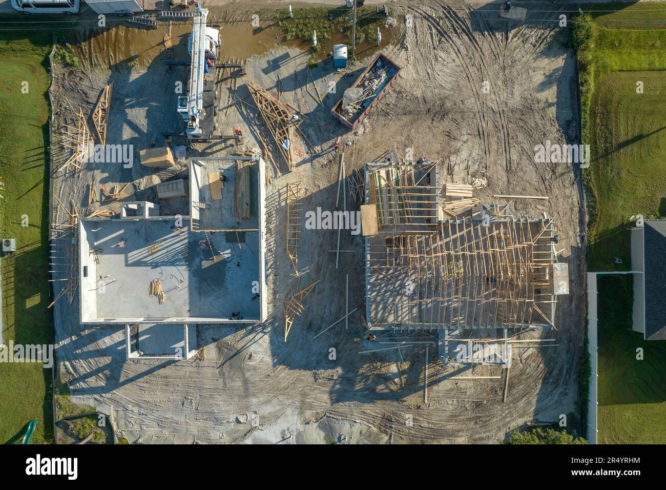 Professional builders working on roof construction of unfinished ...