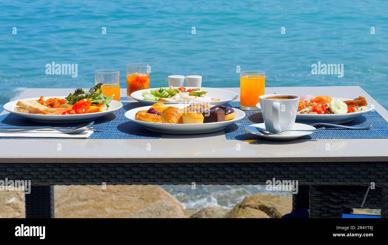 Delicious breakfast on coast, surrounded by the stunning views Stock ...