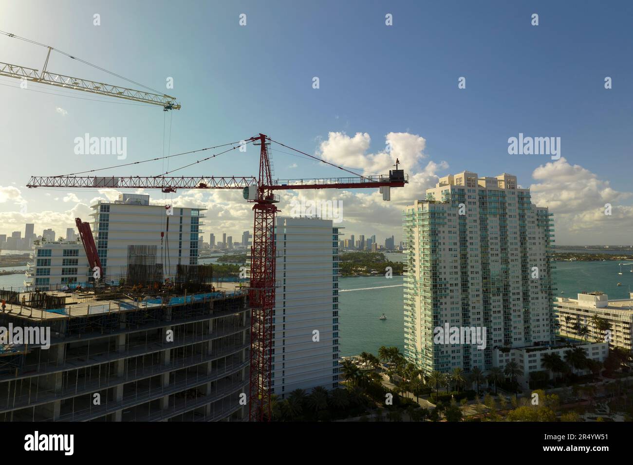 Aerial view of new developing residense in american urban area. Tower cranes at industrial ...