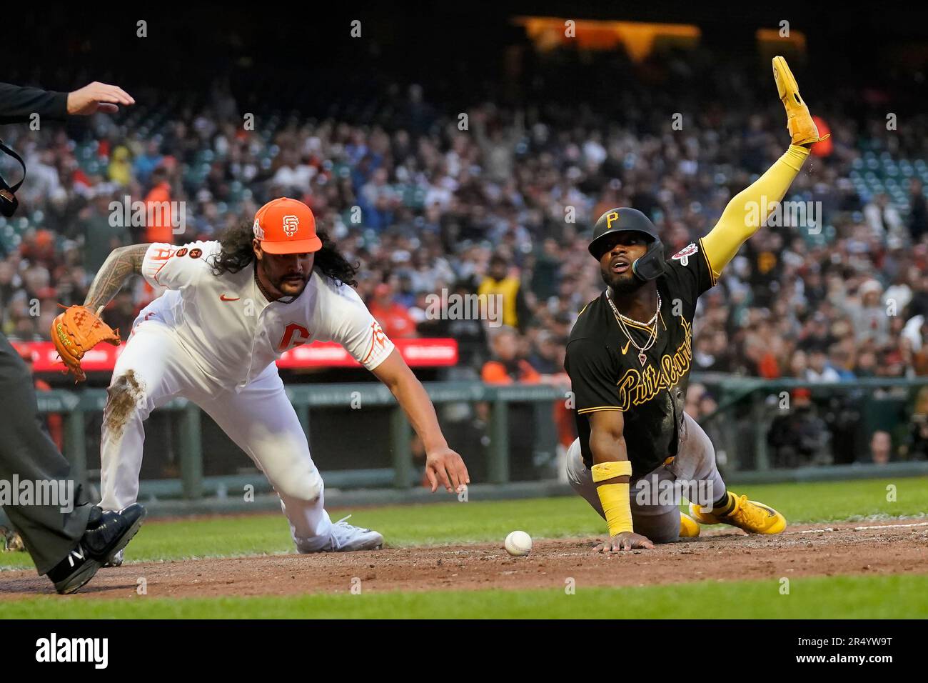 Pittsburgh Pirates' Rodolfo Castro, right, gestures, after scoring on a ...