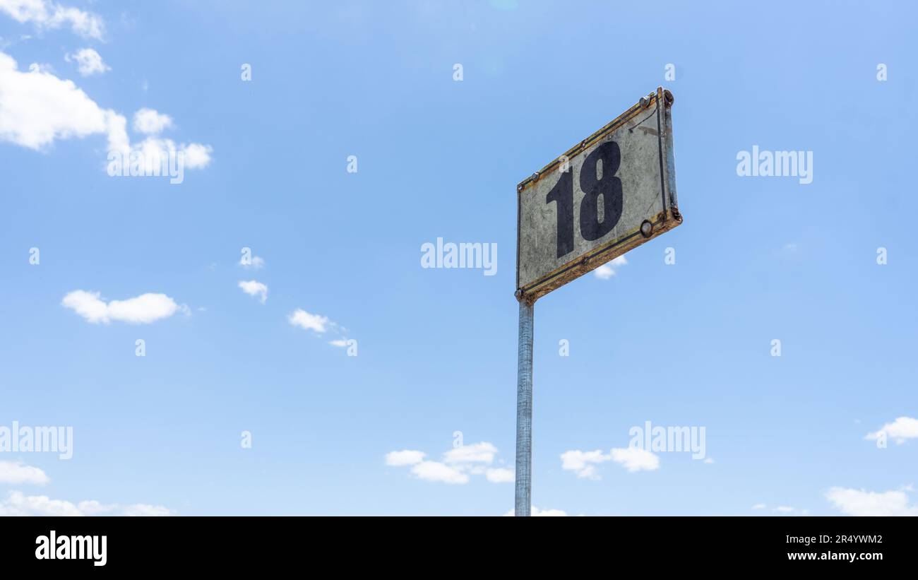 Sign of a cattle pen with the number 18 Stock Photo - Alamy