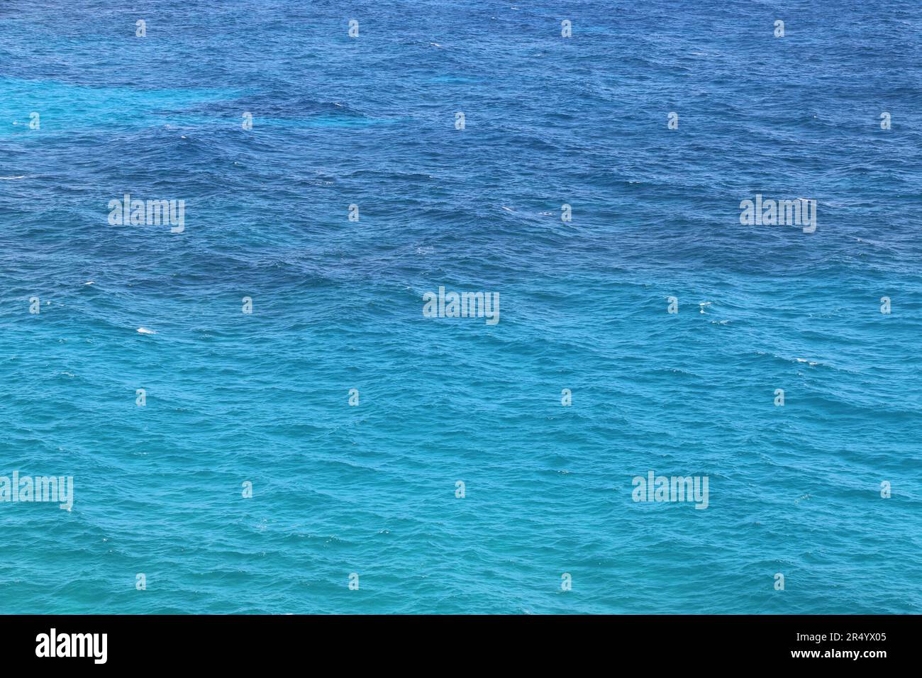 Calm ocean waters with contrasting shades of turquoise and deep blue ...