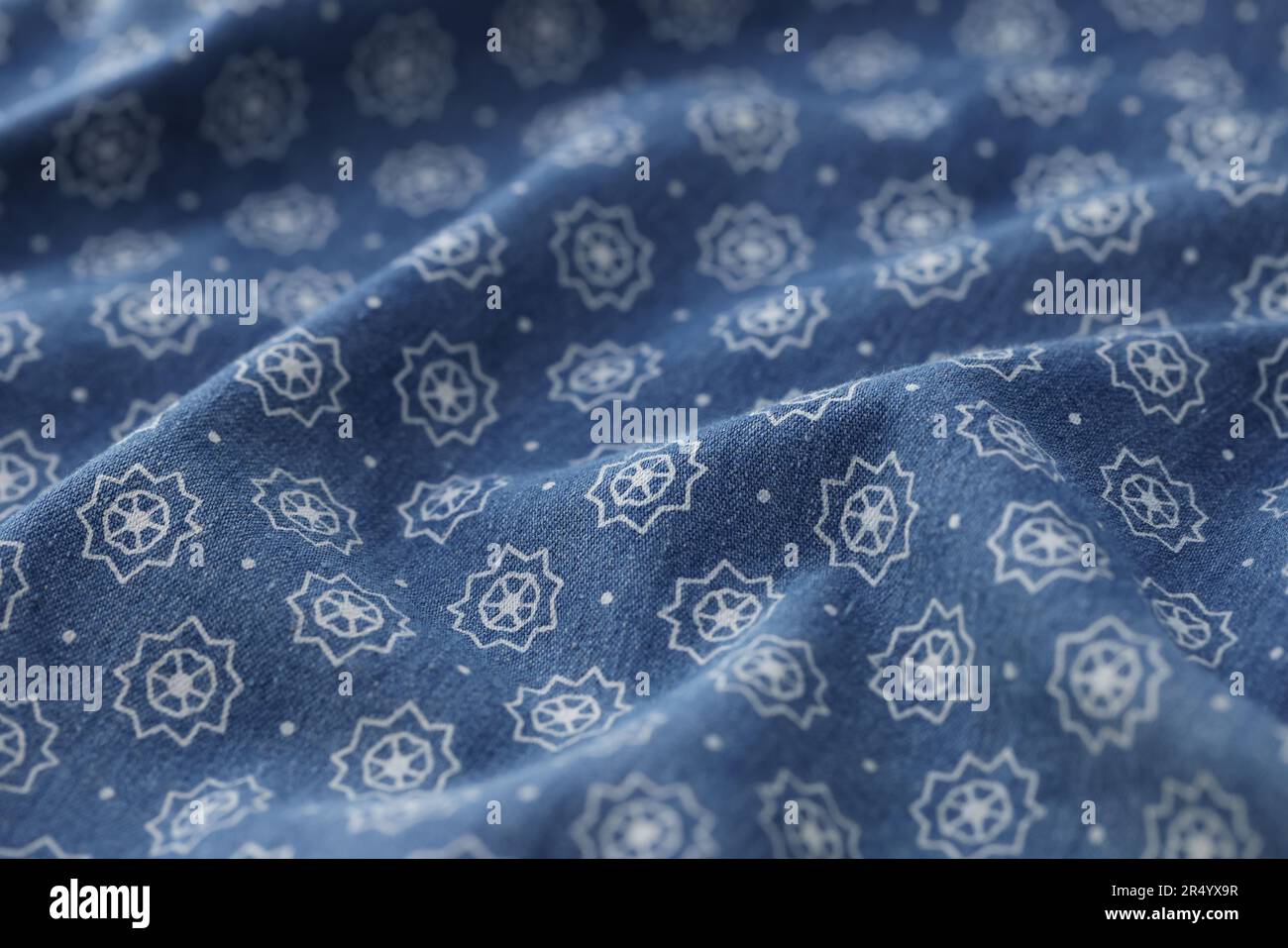 Wavy blue cotton fabric with white patterns as background Stock Photo ...