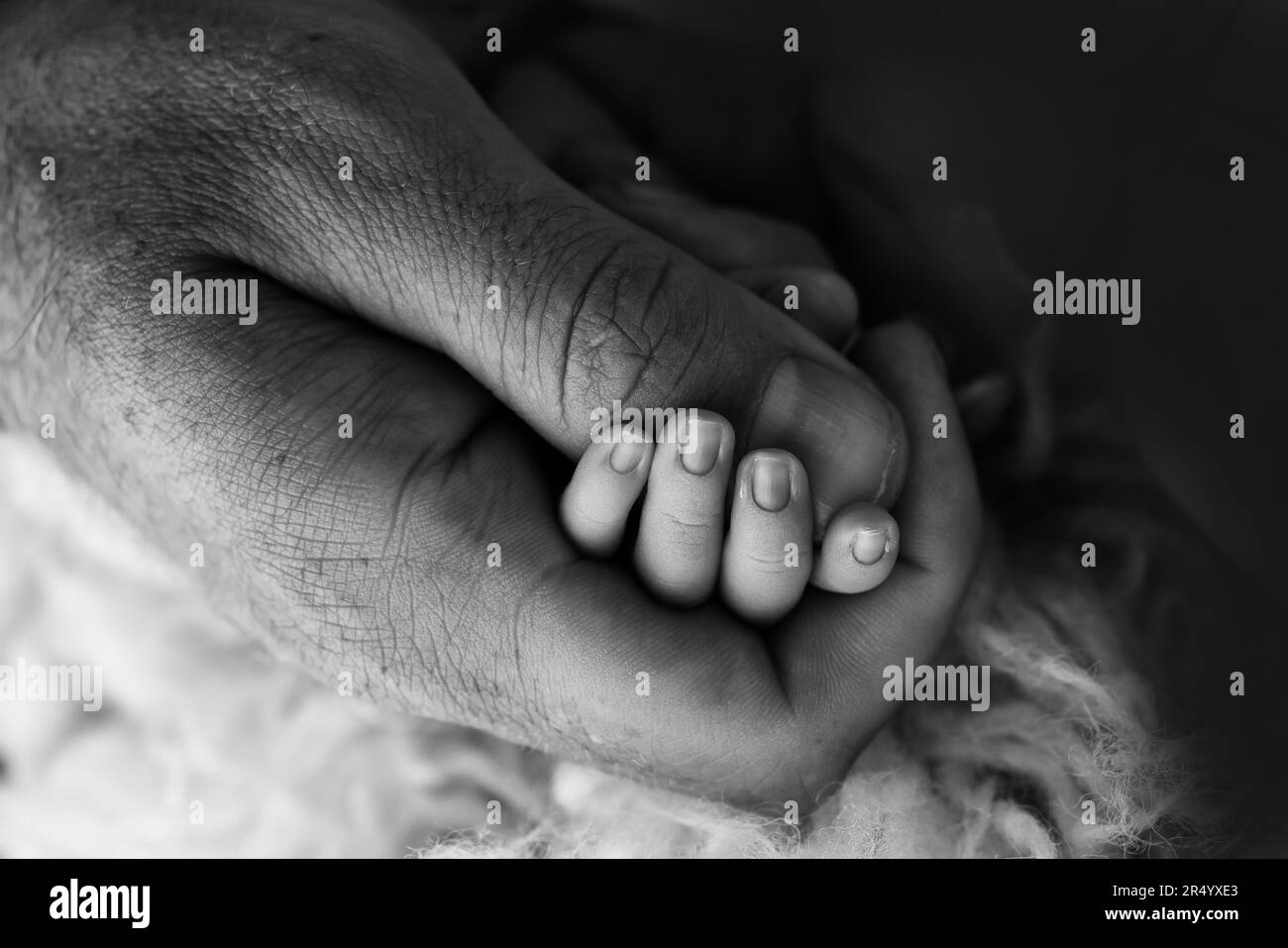 Close-up of a small hand of a child and the hand of mother and father ... Close-up of a small hand of a child and the hand of mother and father ...