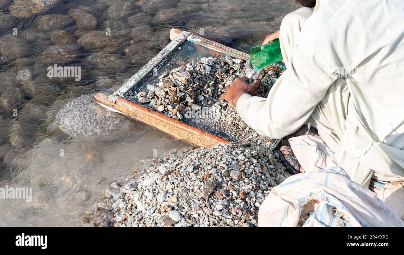 Sorting and picking of valuable stones from the excavations debris of ...