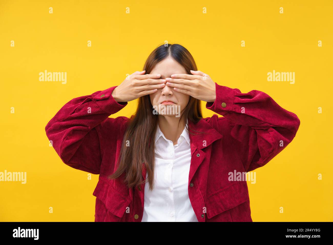 Women are using hand to close eyes while feeling sadness over isolated ...