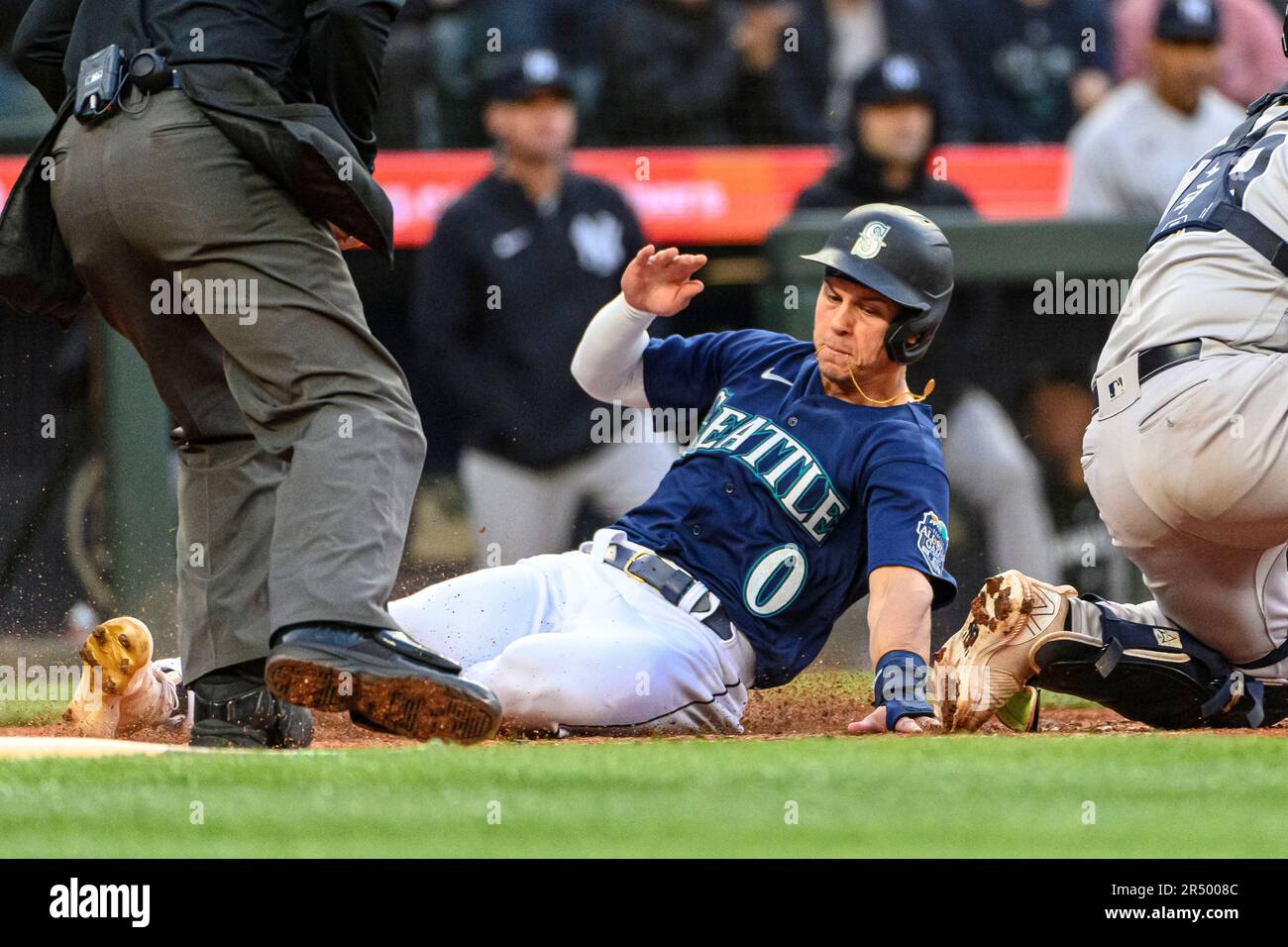 Seattle Mariners' Sam Haggerty scores on a double by Ty France against ...