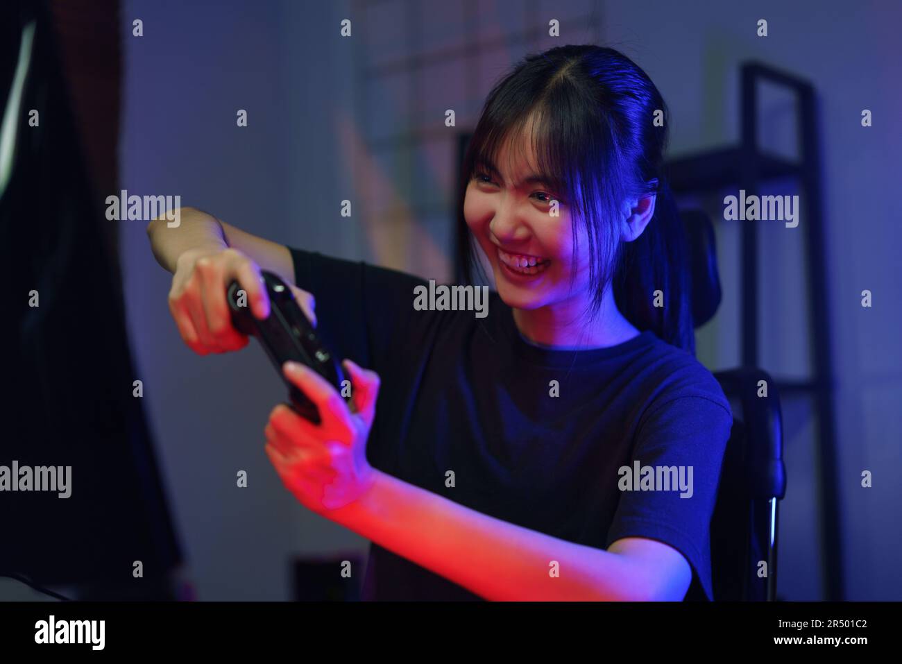 Female cyber hacker gamer playing or streaming video games on computer ...