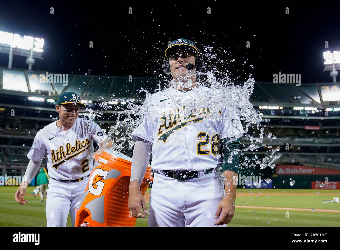 Oakland Athletics' Nick Allen, left, douses Jonah Bride with iced water ...