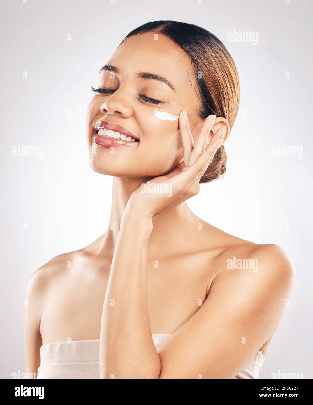 Woman with smile, cream on face and beauty, skincare and moisturizer ...