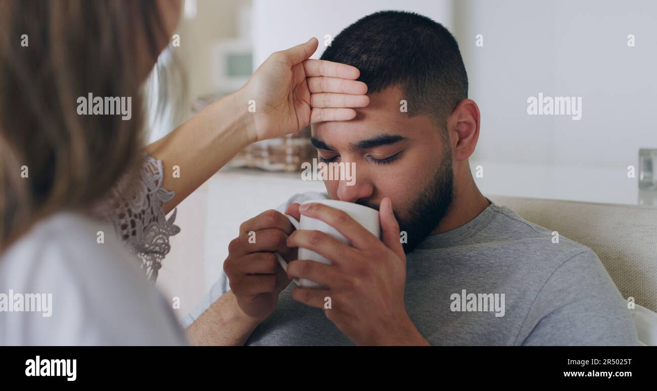 Sick, fever and tea with couple in bedroom for problem, medical and ...