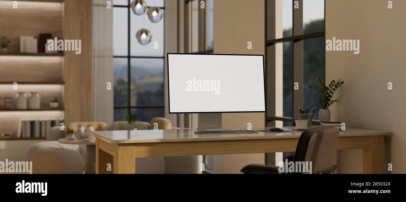 A computer white screen mockup on a table in a modern luxury office or ...