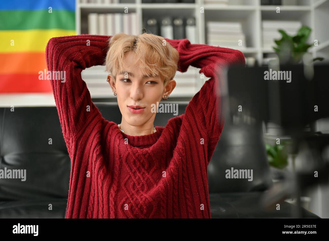 Portrait of an attractive young Asian gay influencer or blogger filming ...