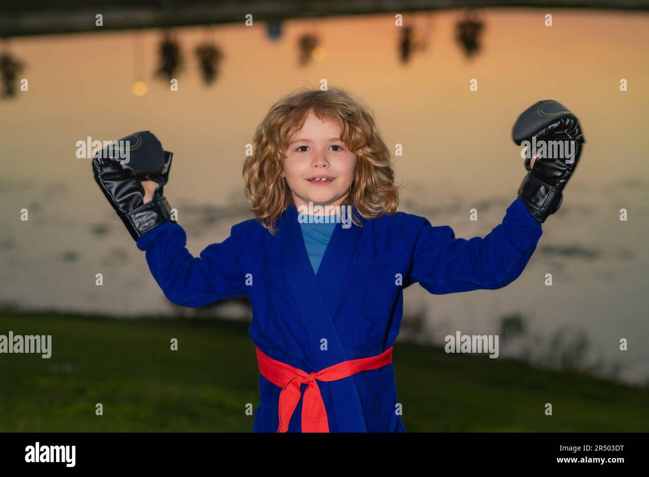 Little karate fighter. Kid boy practicing karate outdoor. Sport karate ...