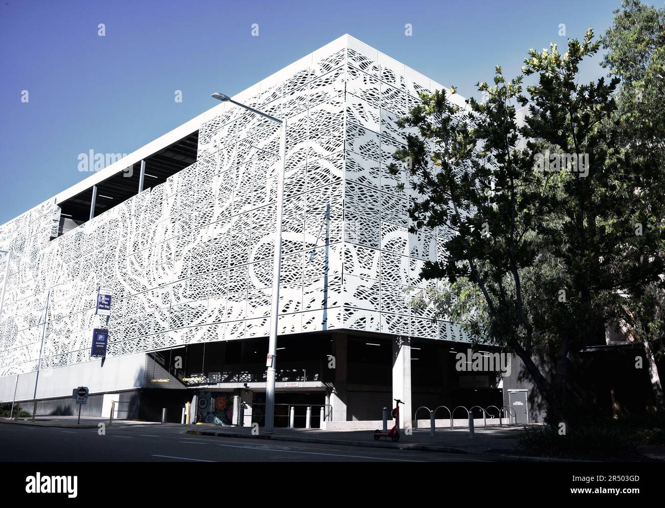 A Low Angle Photograph Of The Intricate Patterns Designed Into The Metal Facade Of A Public Car