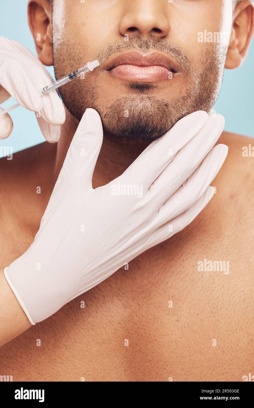 Skincare, botox and lips with a man in studio on a gray background for ...