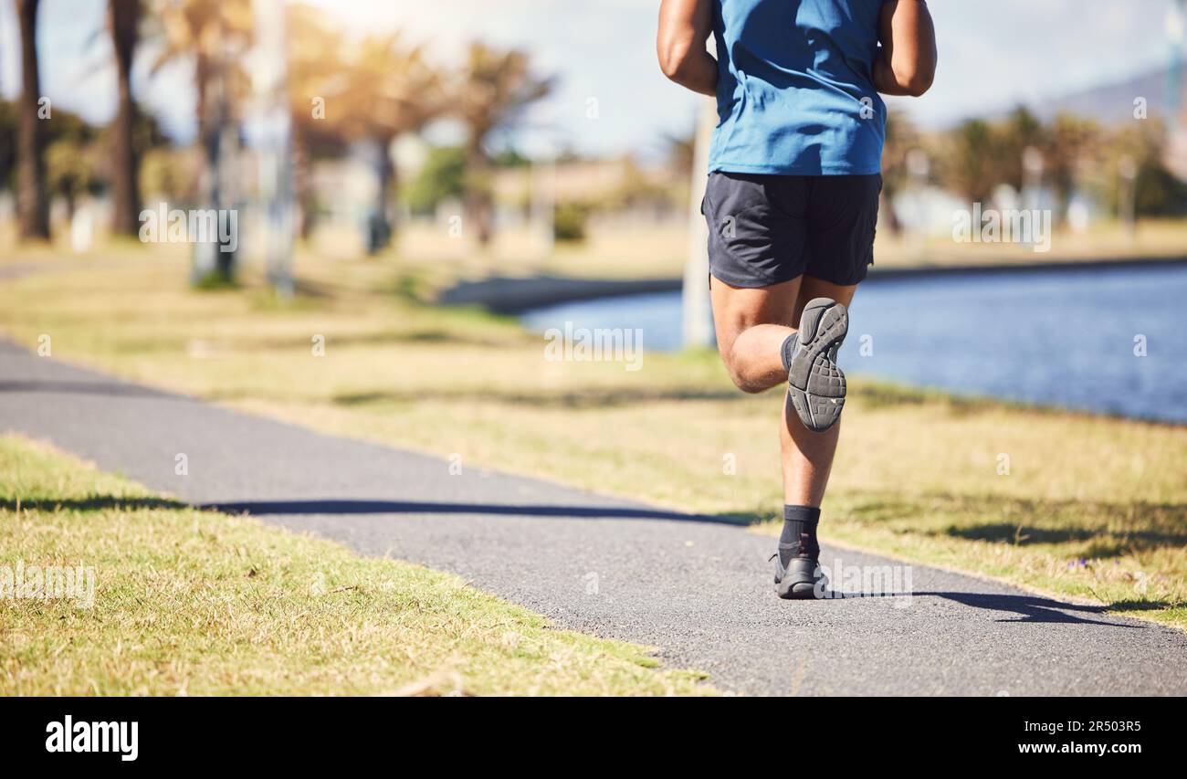 Fitness, legs and man or runner outdoor for exercise, training or ...