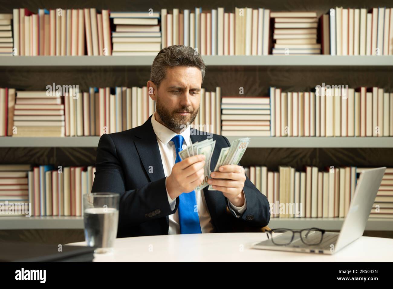 Business man in suit with cash money dollars banknotes isolated at ...