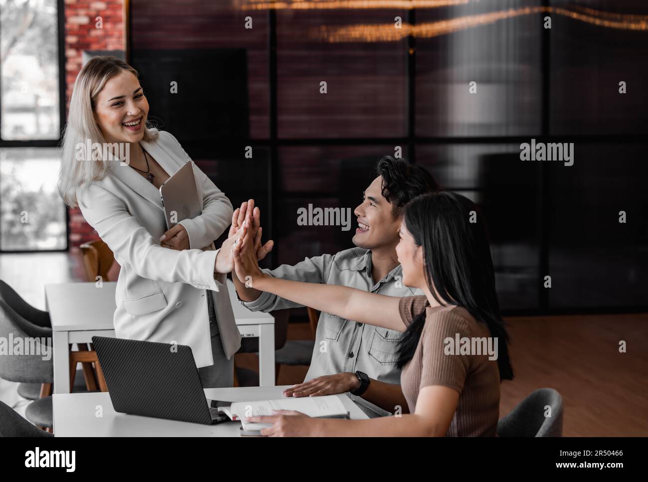 College students join study groups in the academic library to work on ...