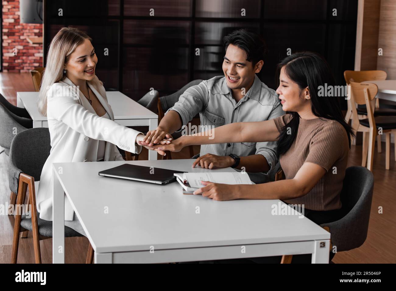 College students join study groups in the academic library to work on ...
