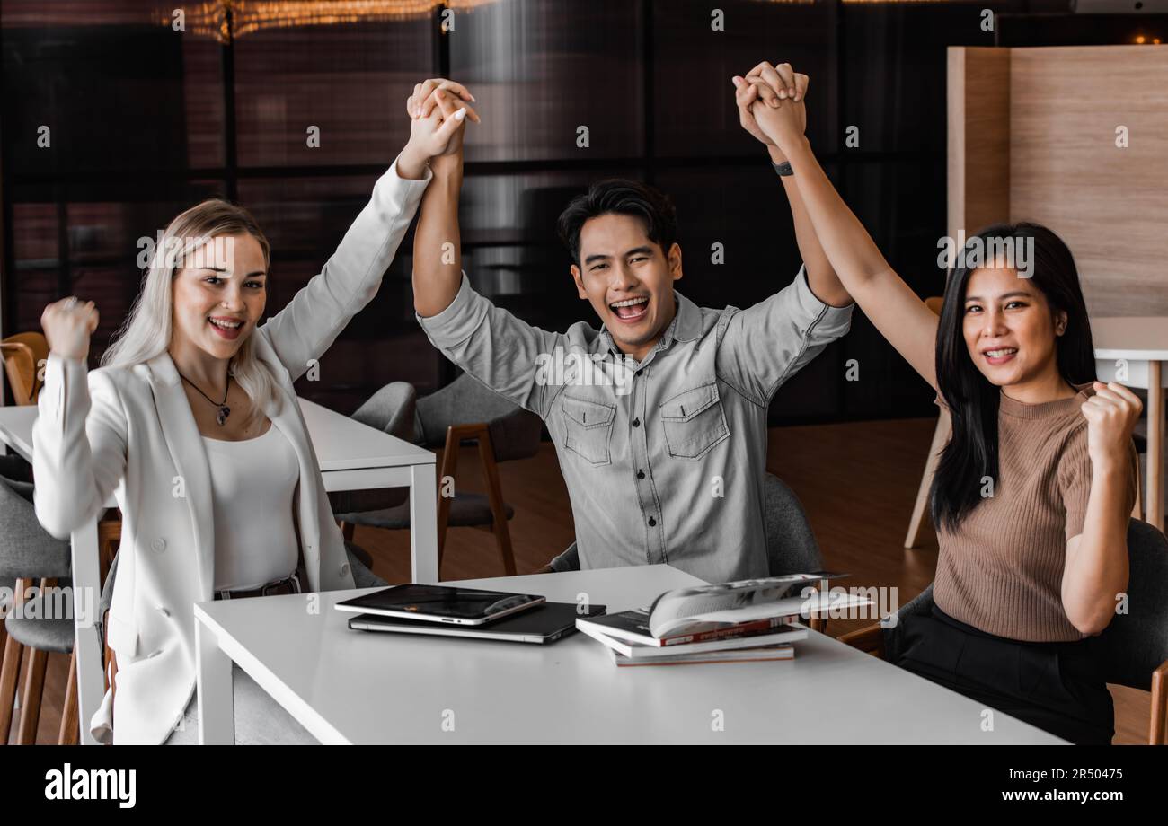 College students join study groups in the academic library to work on ...