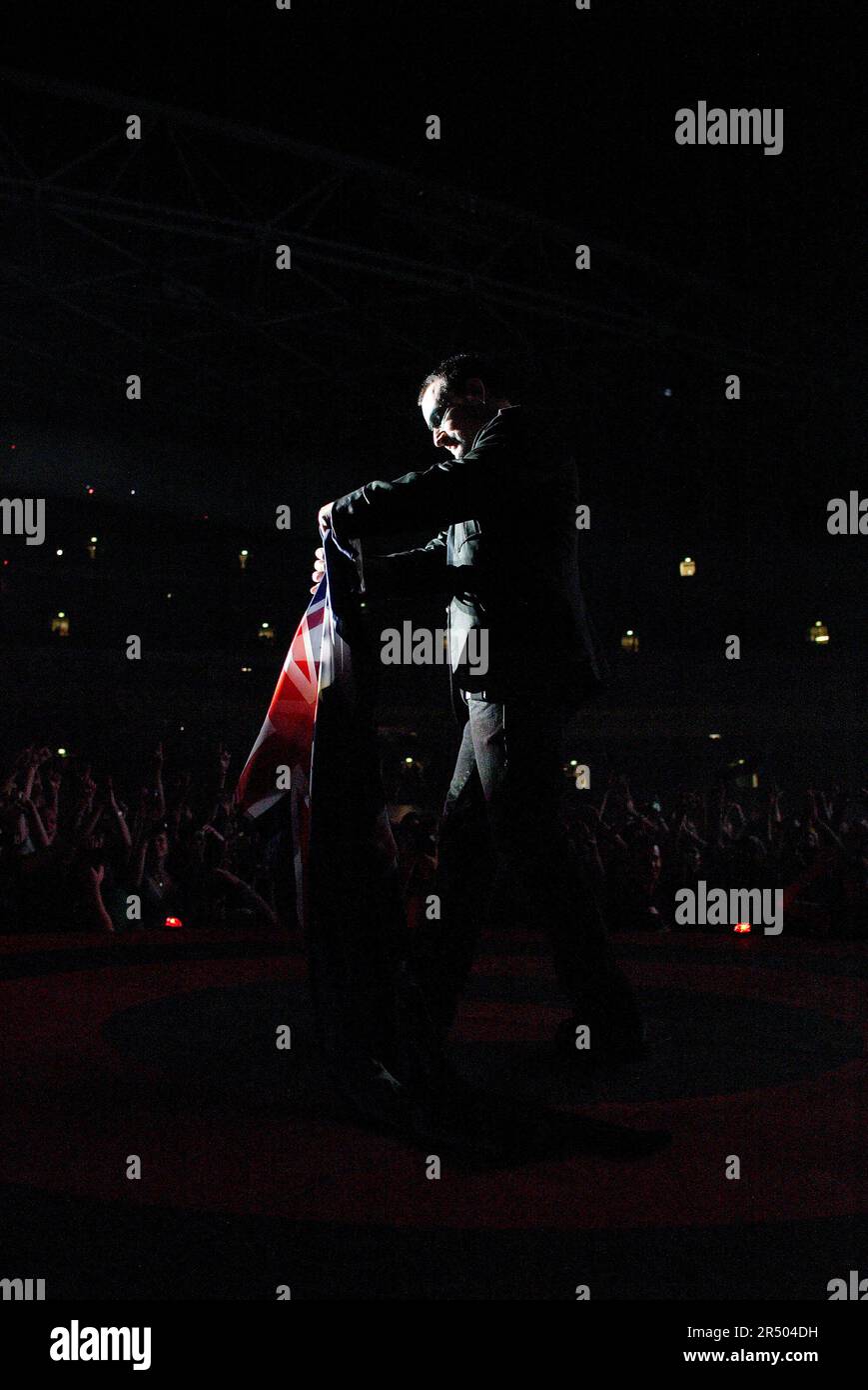 Bono and U2 play to a crowd of 75,000 at Telstra Stadium on the Vertigo ...