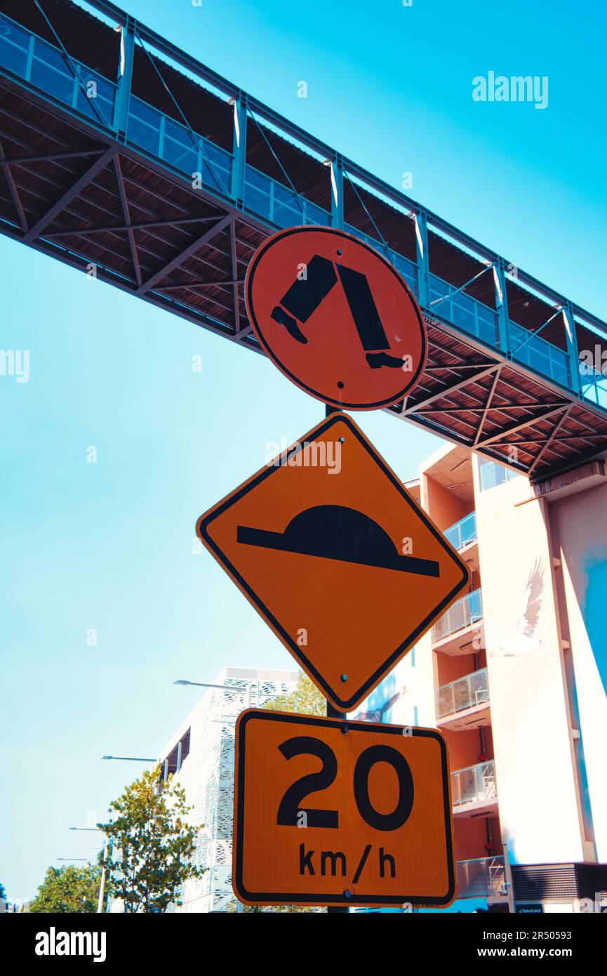 an angled photograph of an elevated pedestrian skybridge connecting the ...