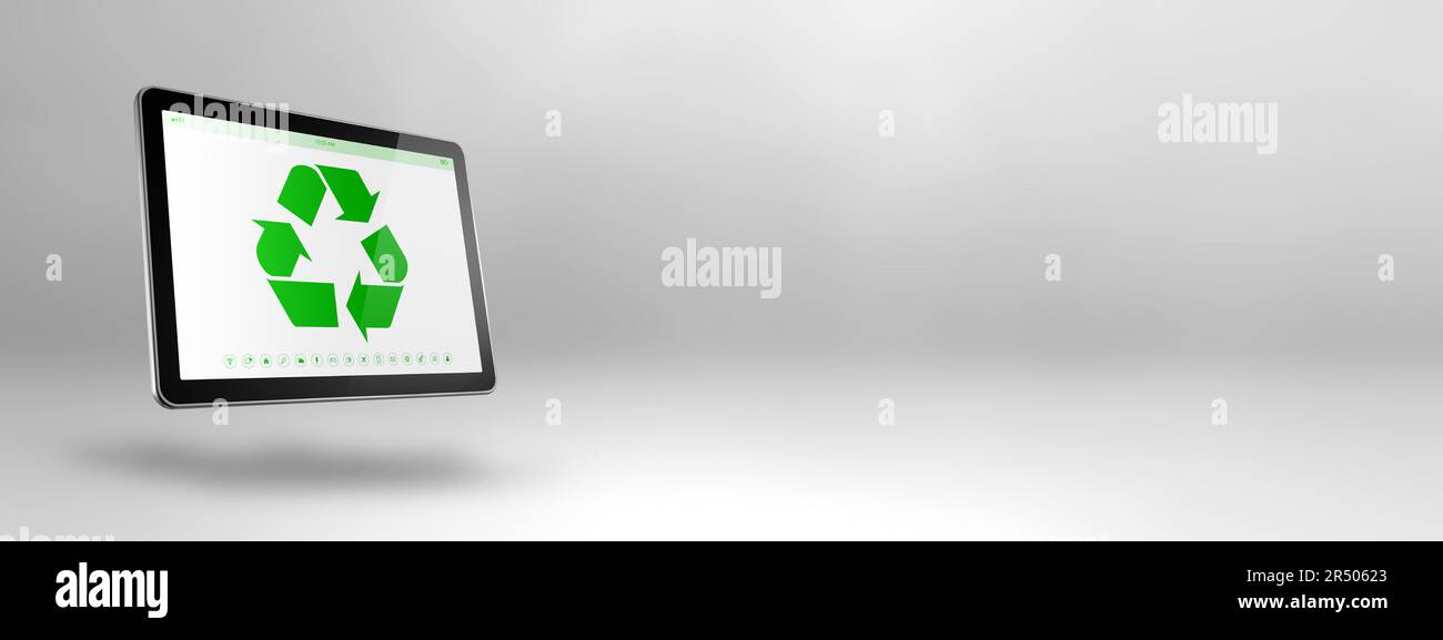 Digital tablet PC with a recycling symbol on screen. environmental ...