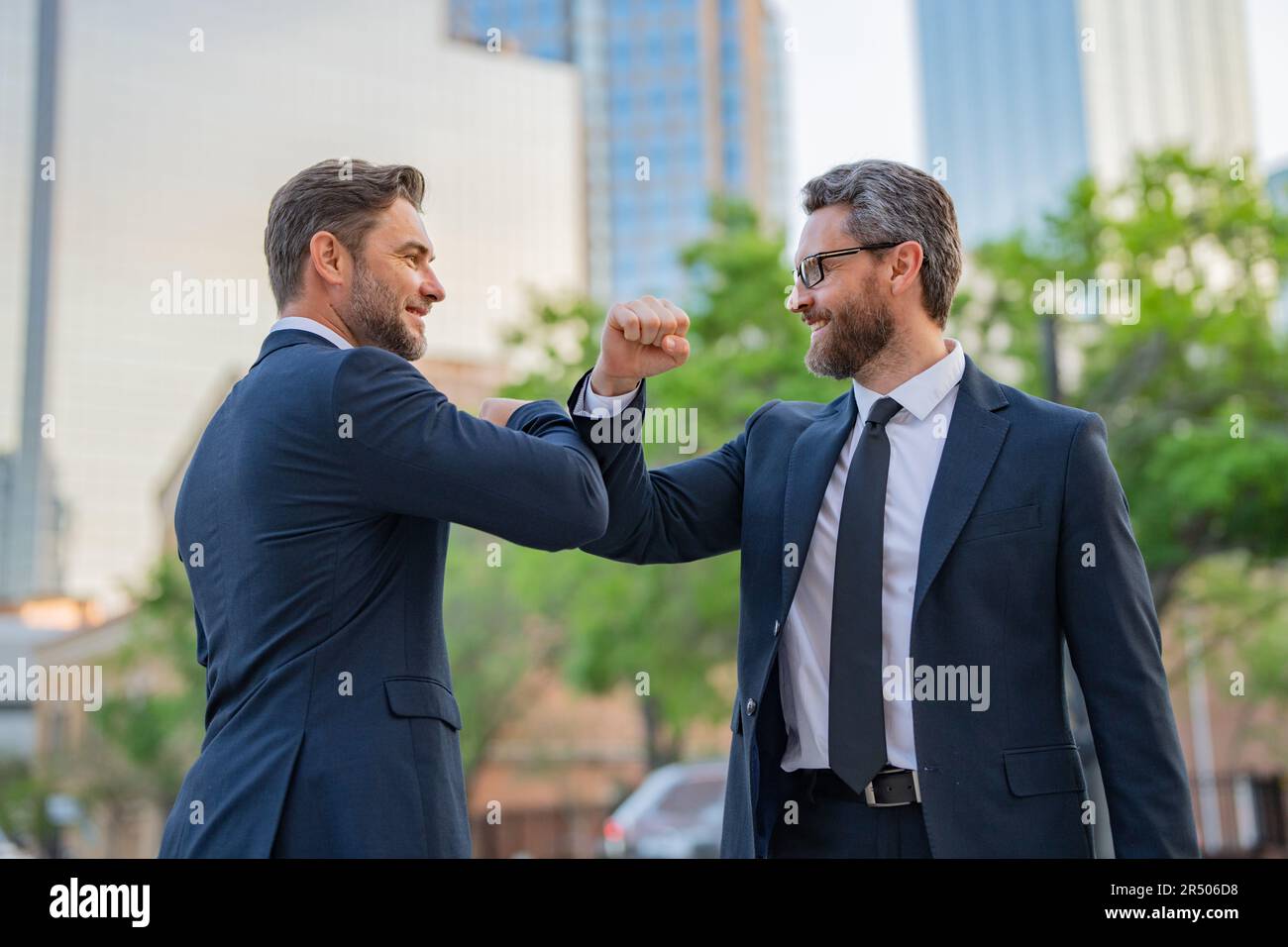 American businessman shaking hands with partner. Business men in suit ...