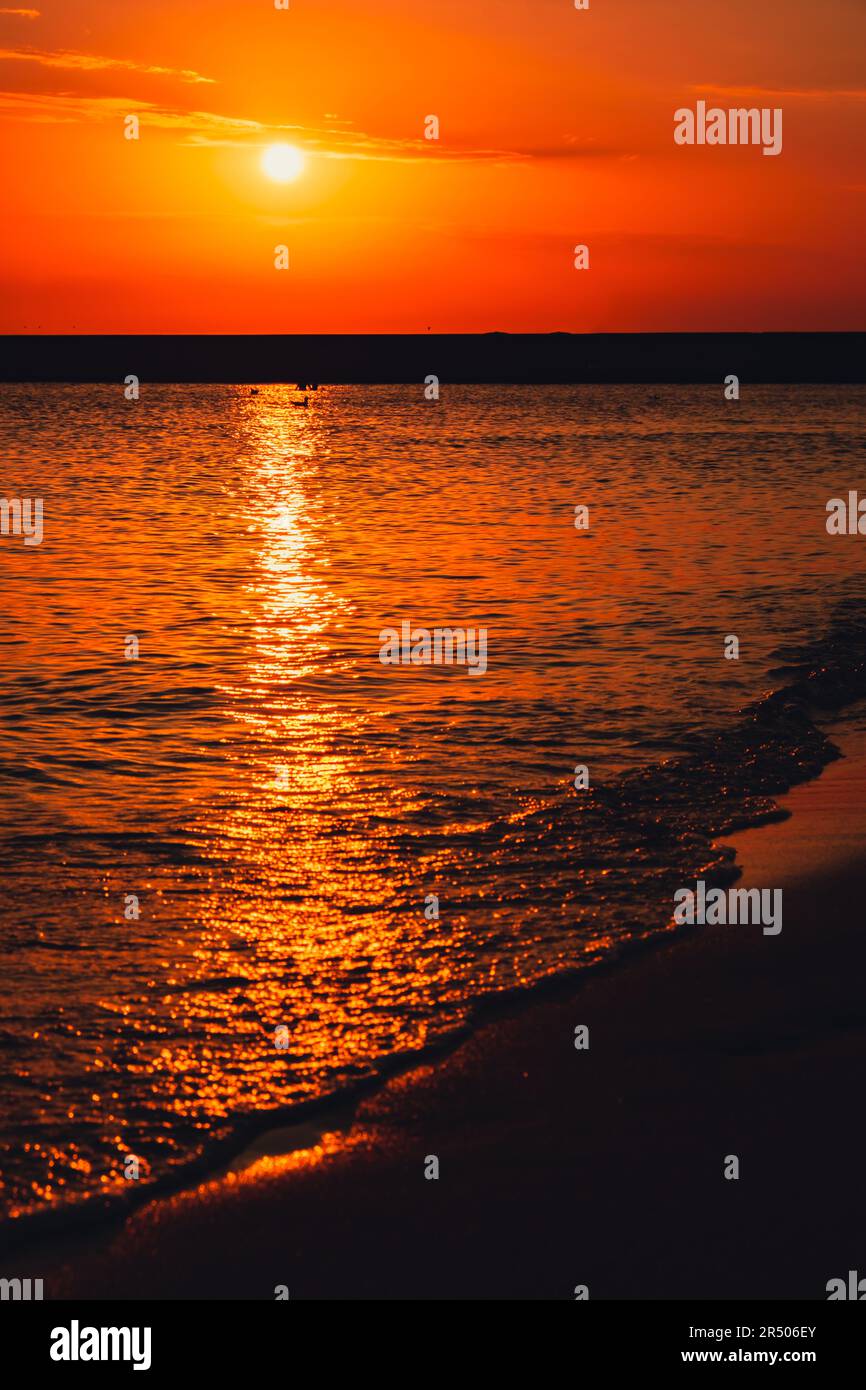 Yellow sun coming out of the sea hi-res stock photography and images ...