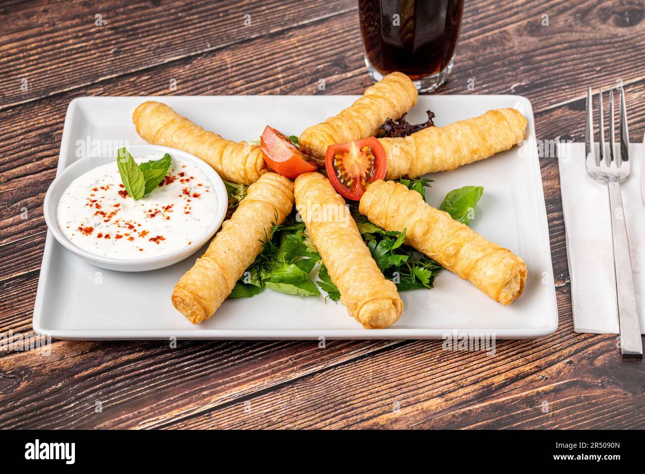 Turkish Cigar Shaped Rolls on a white porcelain plate. The Turkish name ...
