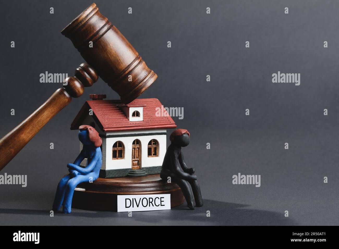 Word Divorce, house model, plasticine people figures and wooden gavel ...