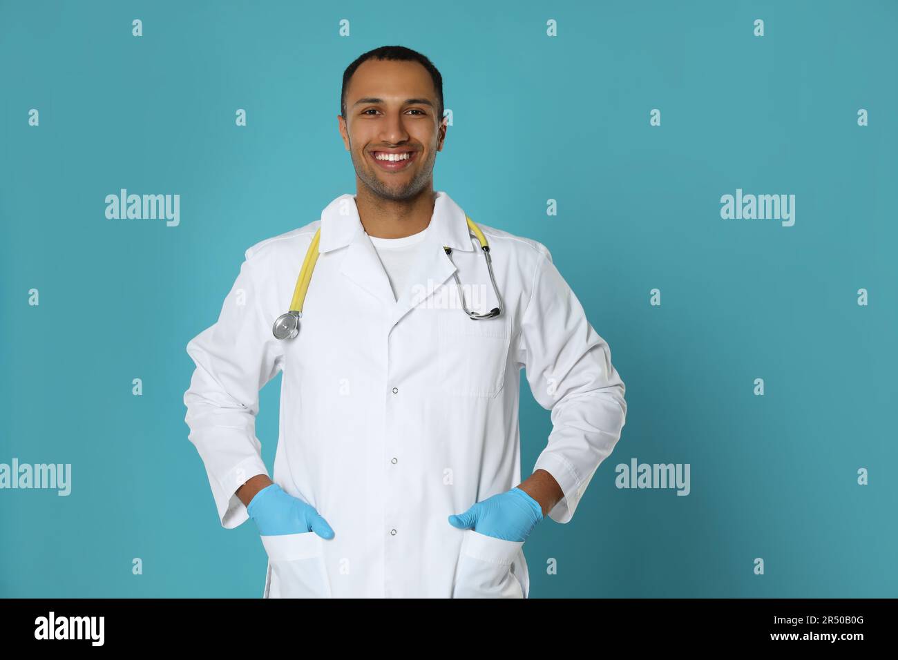 Happy doctor or medical assistant (male nurse) with stethoscope on ...