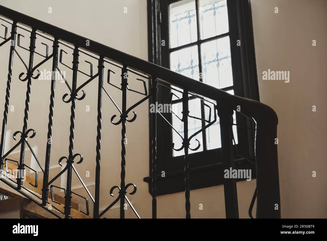Stairs and black metal railing indoors. Interior design Stock Photo - Alamy
