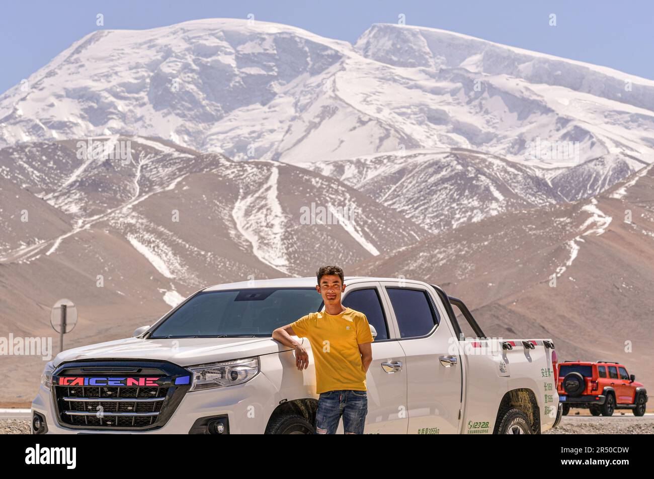Urumqi. 14th Apr, 2023. Alimjan Dawut poses for a photo in front of his ...