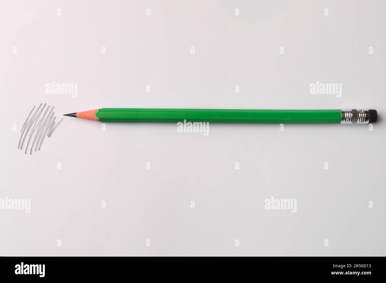 Sharp graphite pencil with eraser and hand drawn scribble on white ...