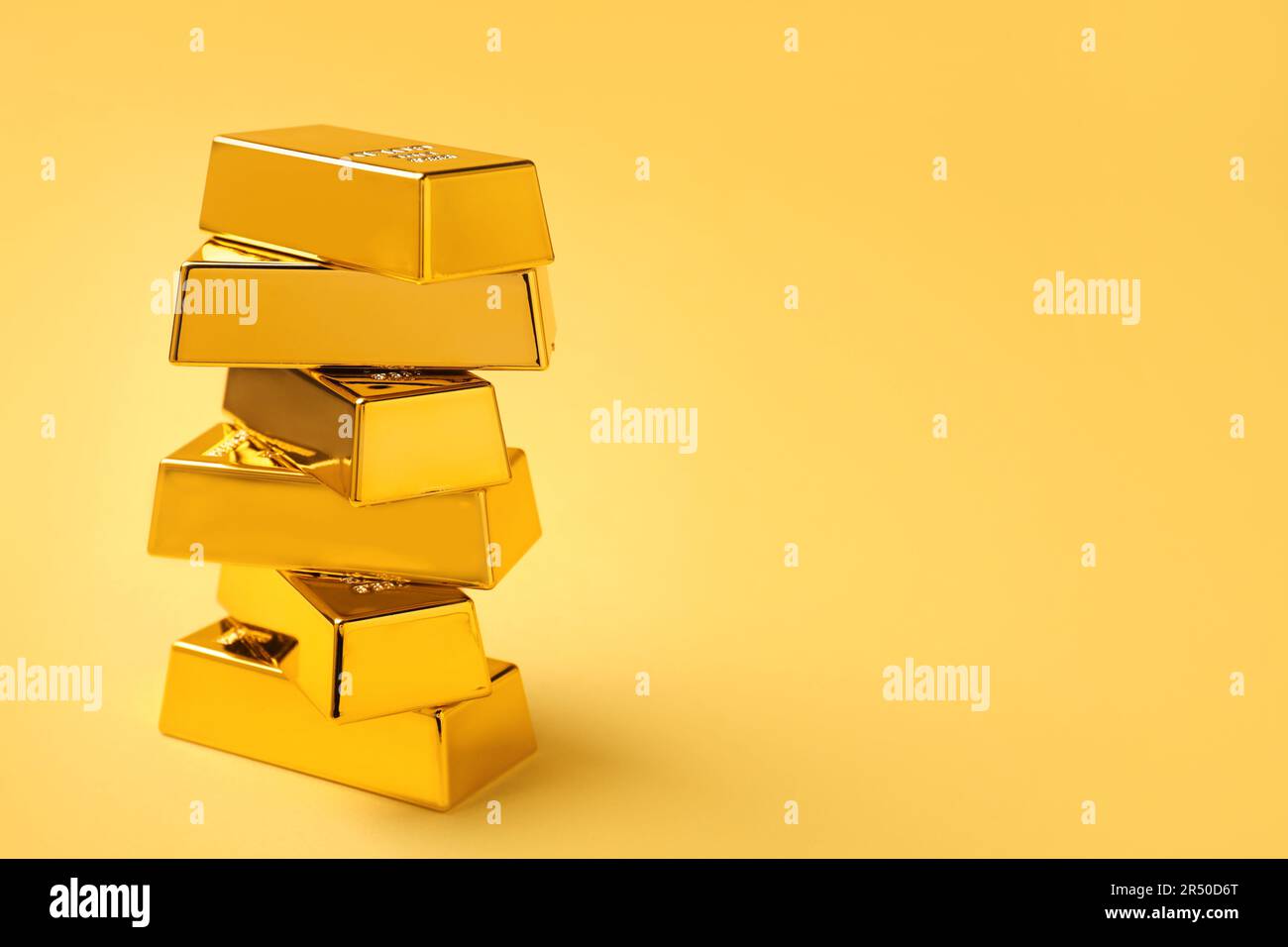 Stack of shiny gold bars on yellow background. Space for text Stock Photo - Alamy