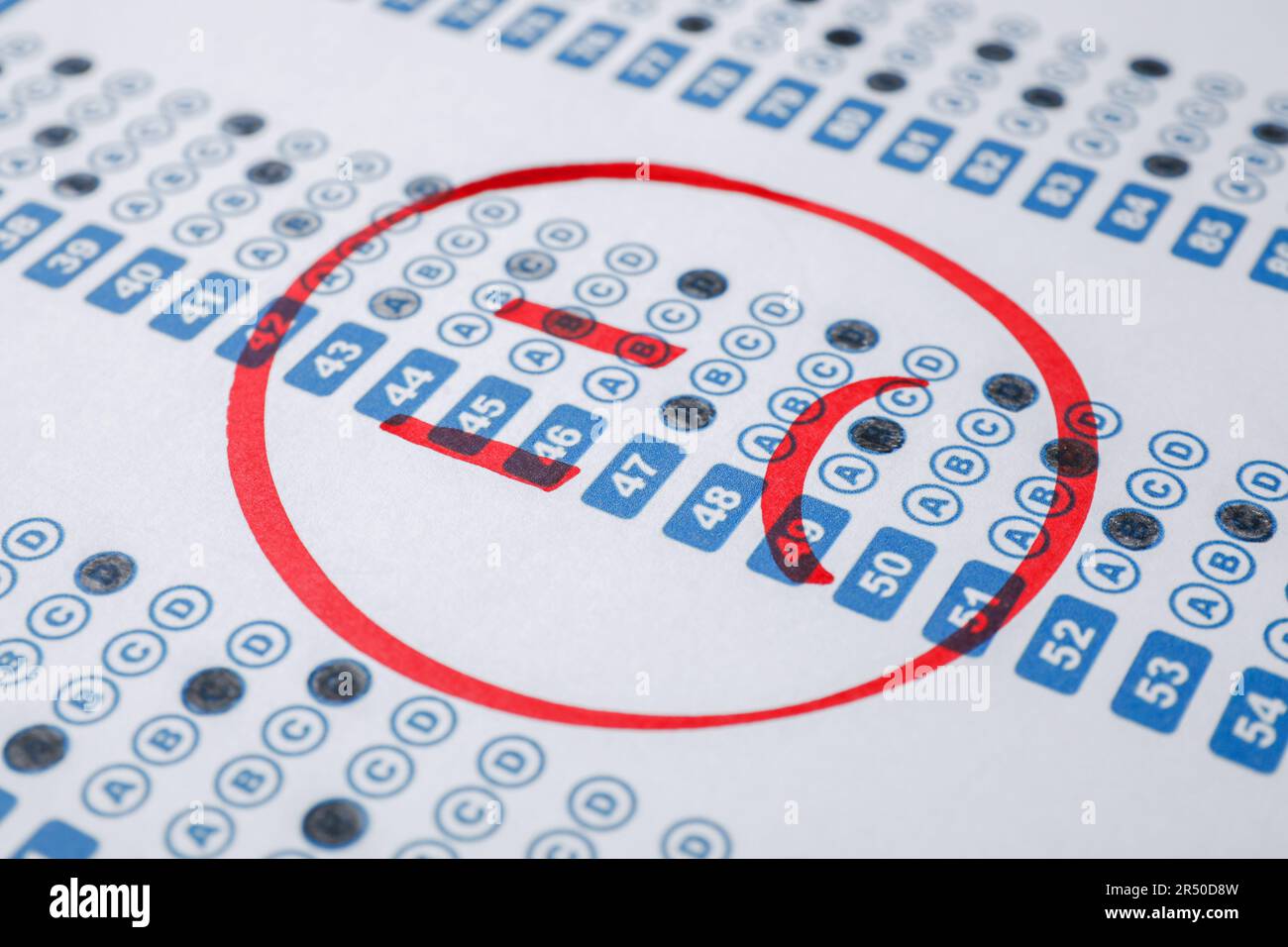 Sad face drawn on answer sheet, closeup. Student passing exam Stock ...