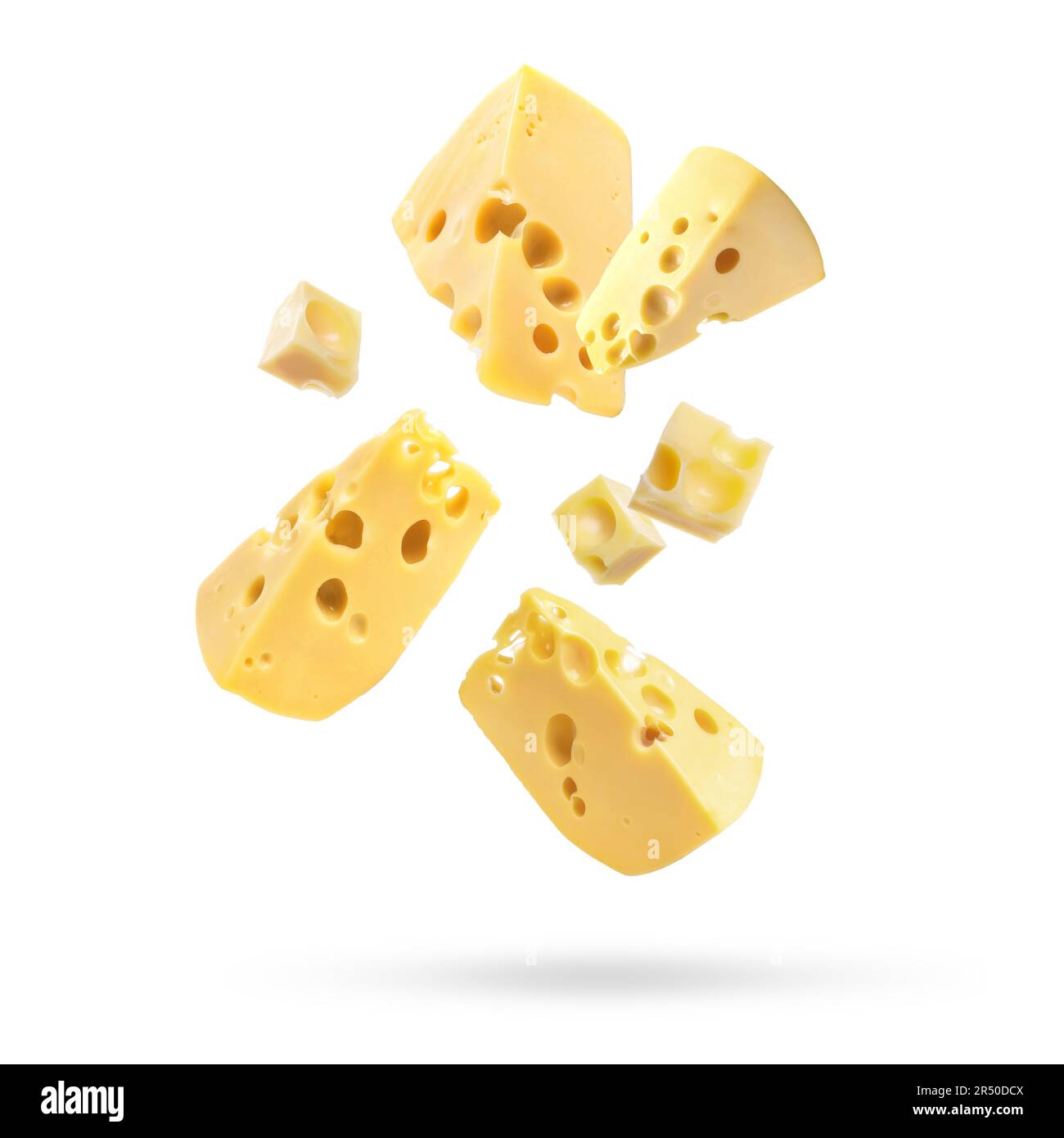 Pieces of delicious cheese falling on white background Stock Photo - Alamy