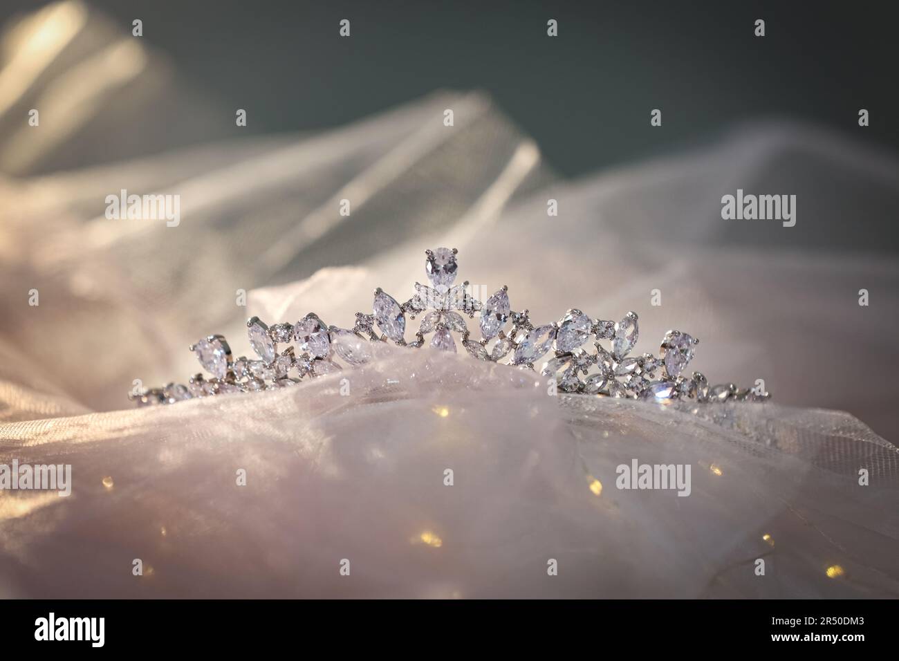Beautiful silver tiara with diamonds on light cloth Stock Photo - Alamy