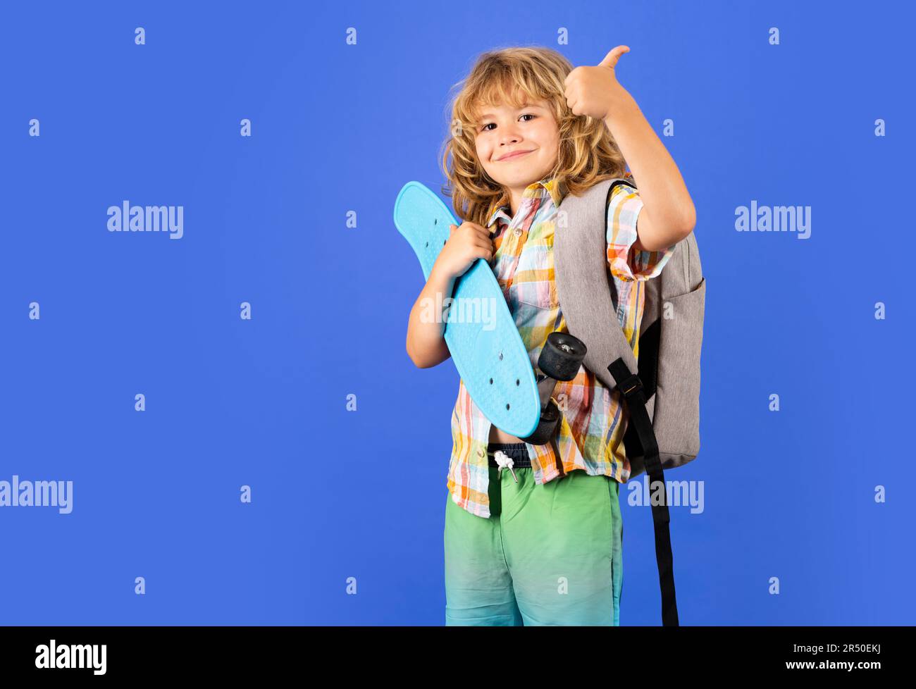 Childhood. Cute child with skateboard on color isoalted background ...