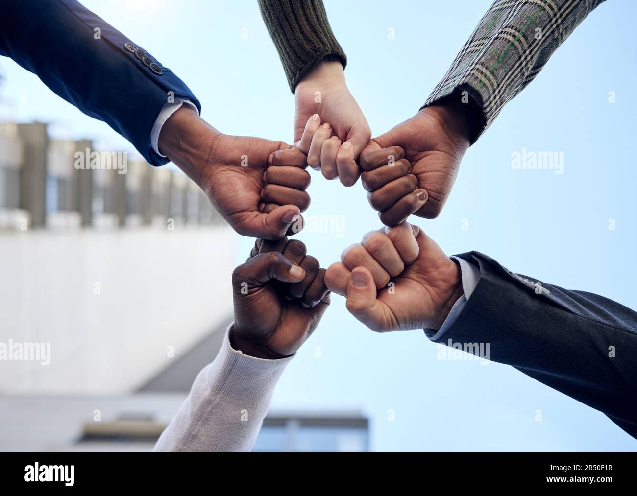 Group, hands and fist pump together for celebration, collaboration or ...