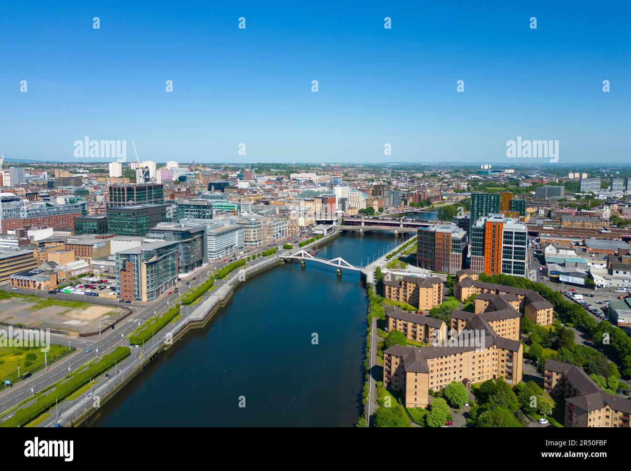 Aerial view from drone of Glasgow city centre skyline along River Clyde ...