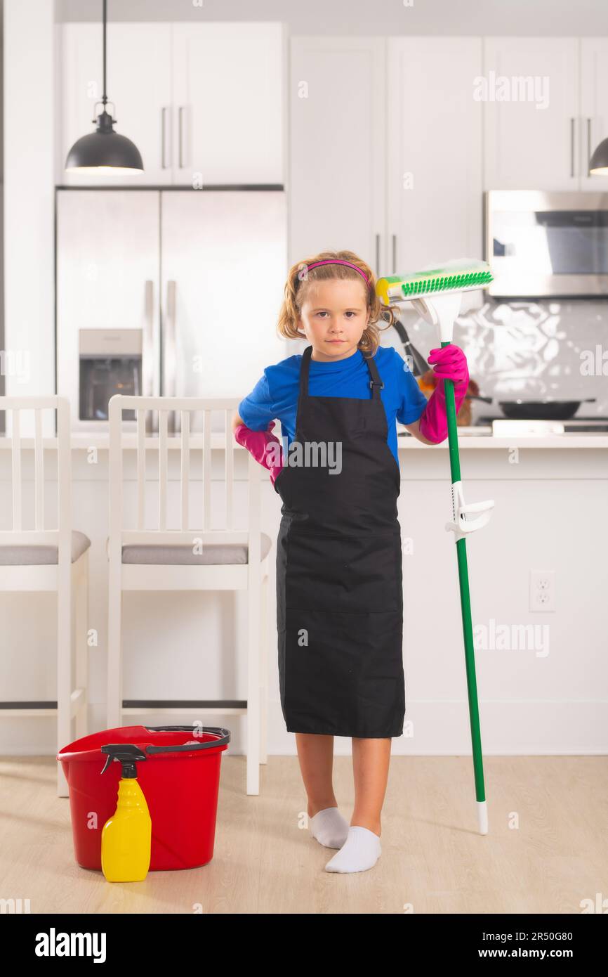 Children helping with housekeeping, cleaning the house. Housekeeping at ...