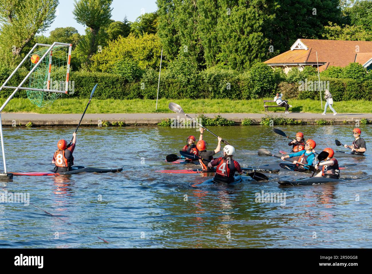 People playing Canoe Polo in kayaks in Exhibition Park lake. Kayak ...
