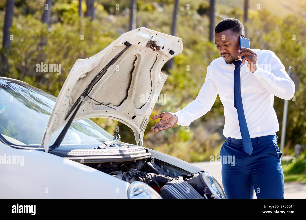 Phone call, car accident and insurance with black man in nature for ...