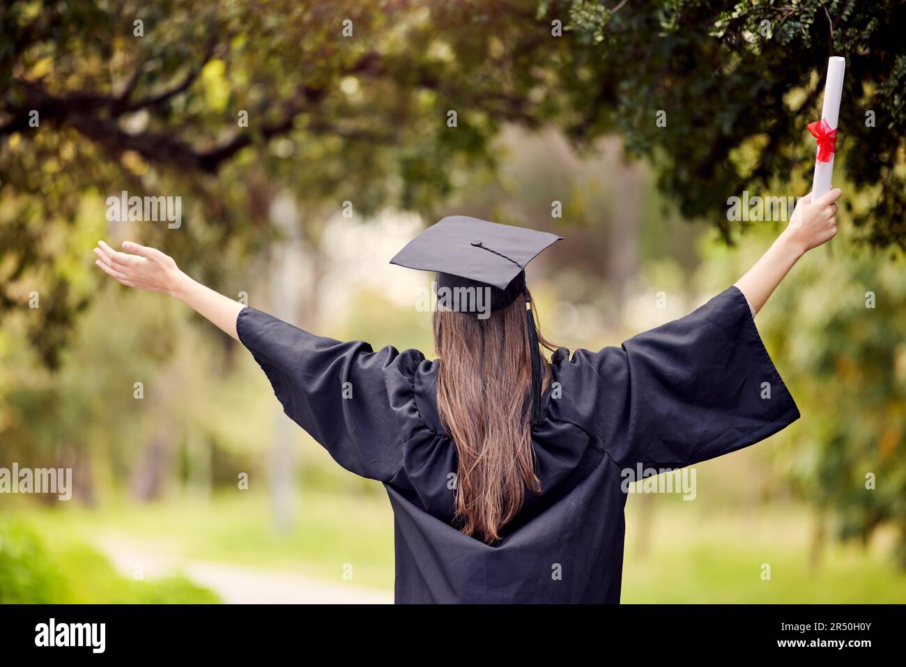 Graduate, woman celebrate and open arms with degree and diploma at ...